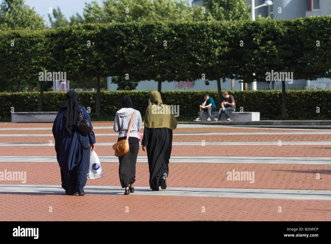 Women walking across Callaghan Square Cardiff Stock Photo - Alamy