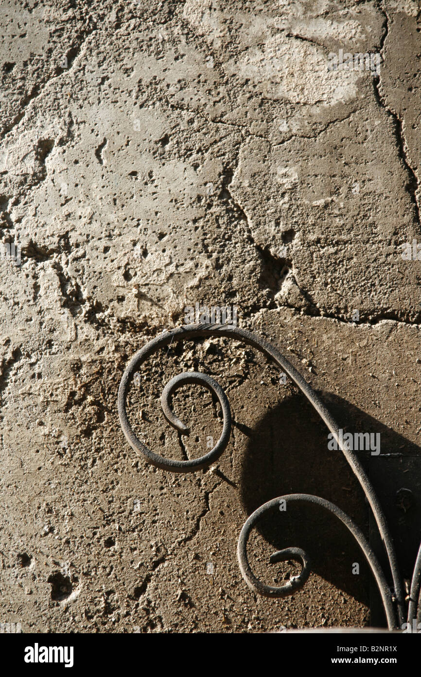 metal wrought iron spiral shadow detail on wall Stock Photo - Alamy