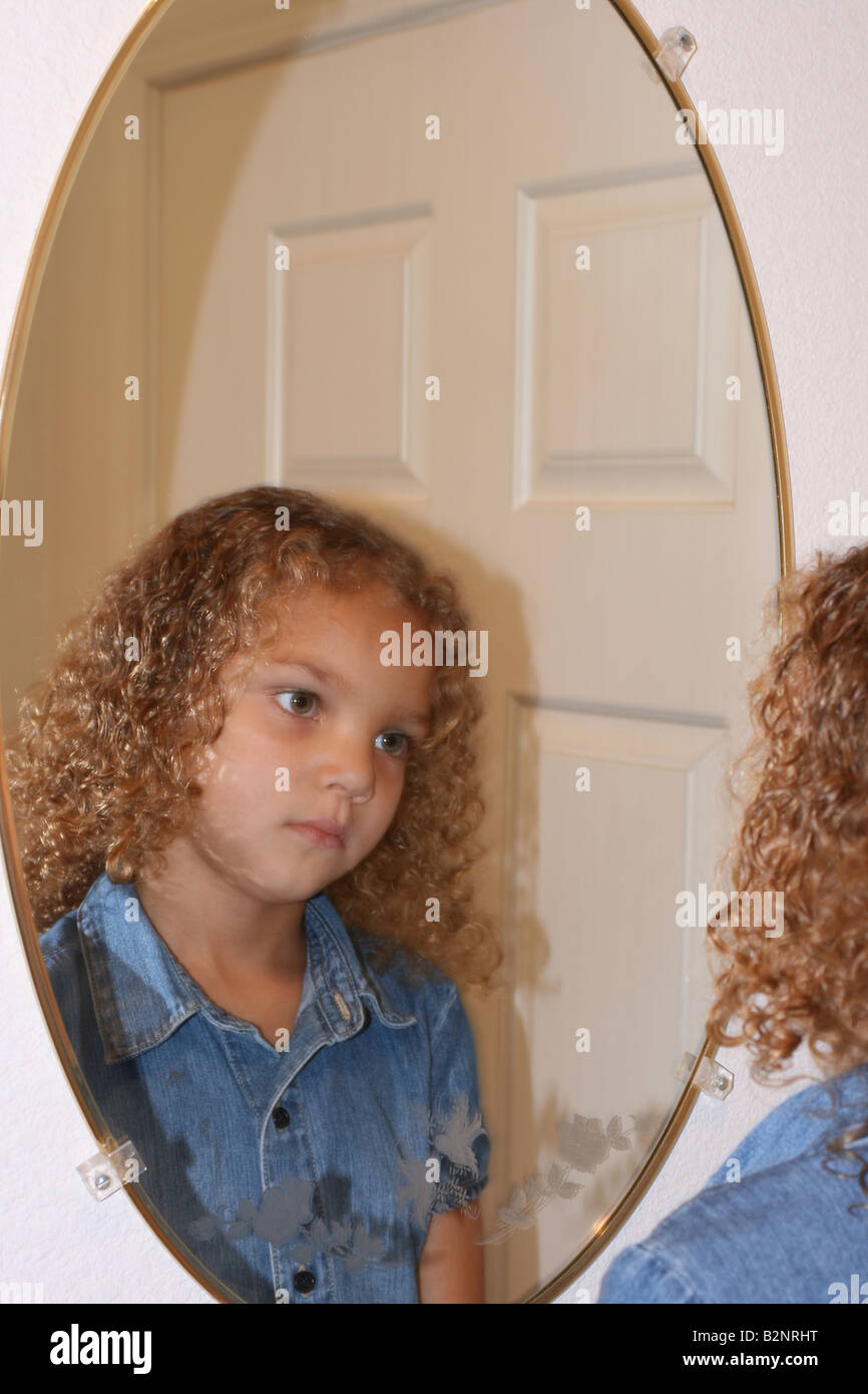 Curly Haired Girl in mirror Stock Photo - Alamy