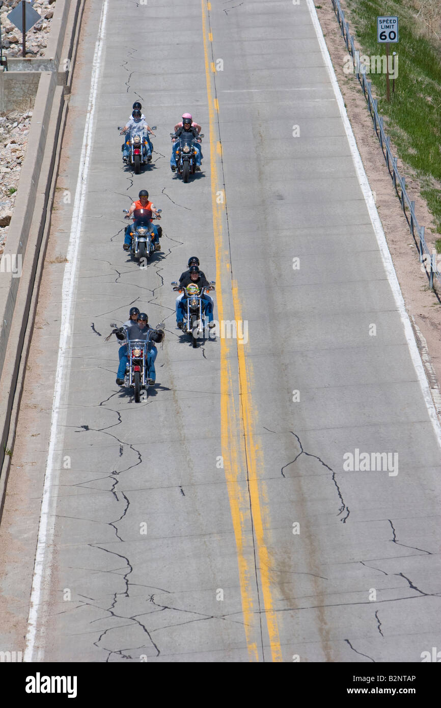 A group of motorcycle riders drive along Kingsley Dam at Lake ...