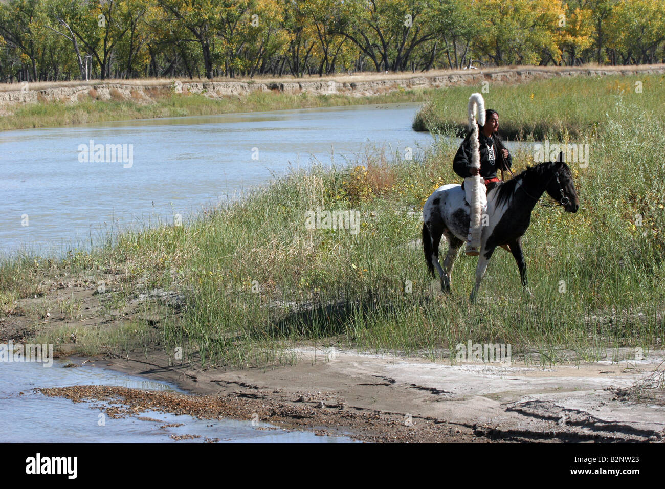 A Native American Sioux Indian on horseback who just crossed a river in ...