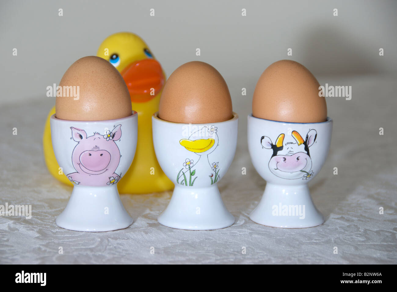 Three boiled eggs (organic, brown) and yellow rubber duck Stock Photo ...