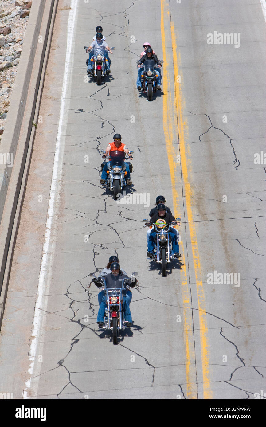 A group of motorcycle riders drive along Kingsley Dam at Lake ...