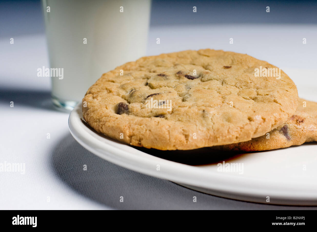Milk and chocolate chip cookies Stock Photo - Alamy
