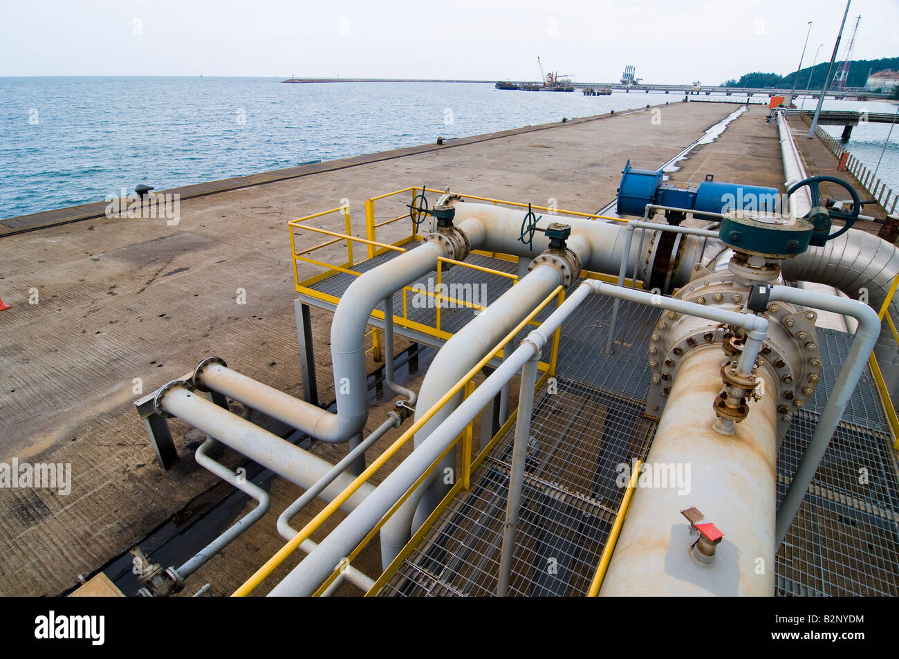 Oil refinery pipes at the loading docks Stock Photo - Alamy