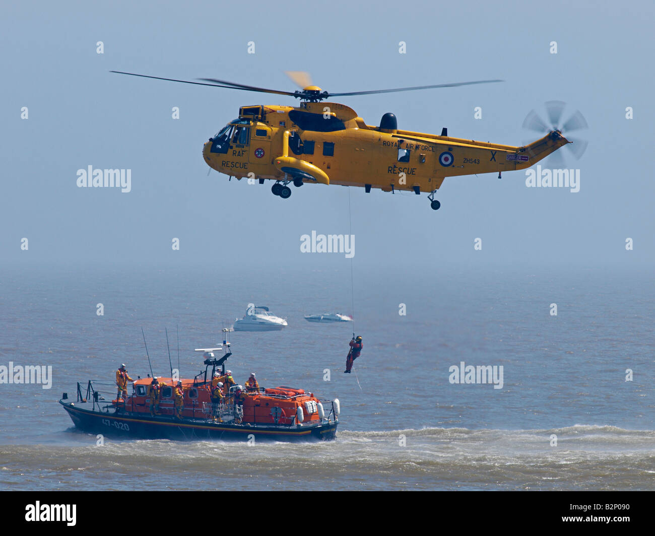 MAN SUSPENDED FROM LINE TRAINING EXERCISE RESCUE BY SEA KING HELICOPTER ...
