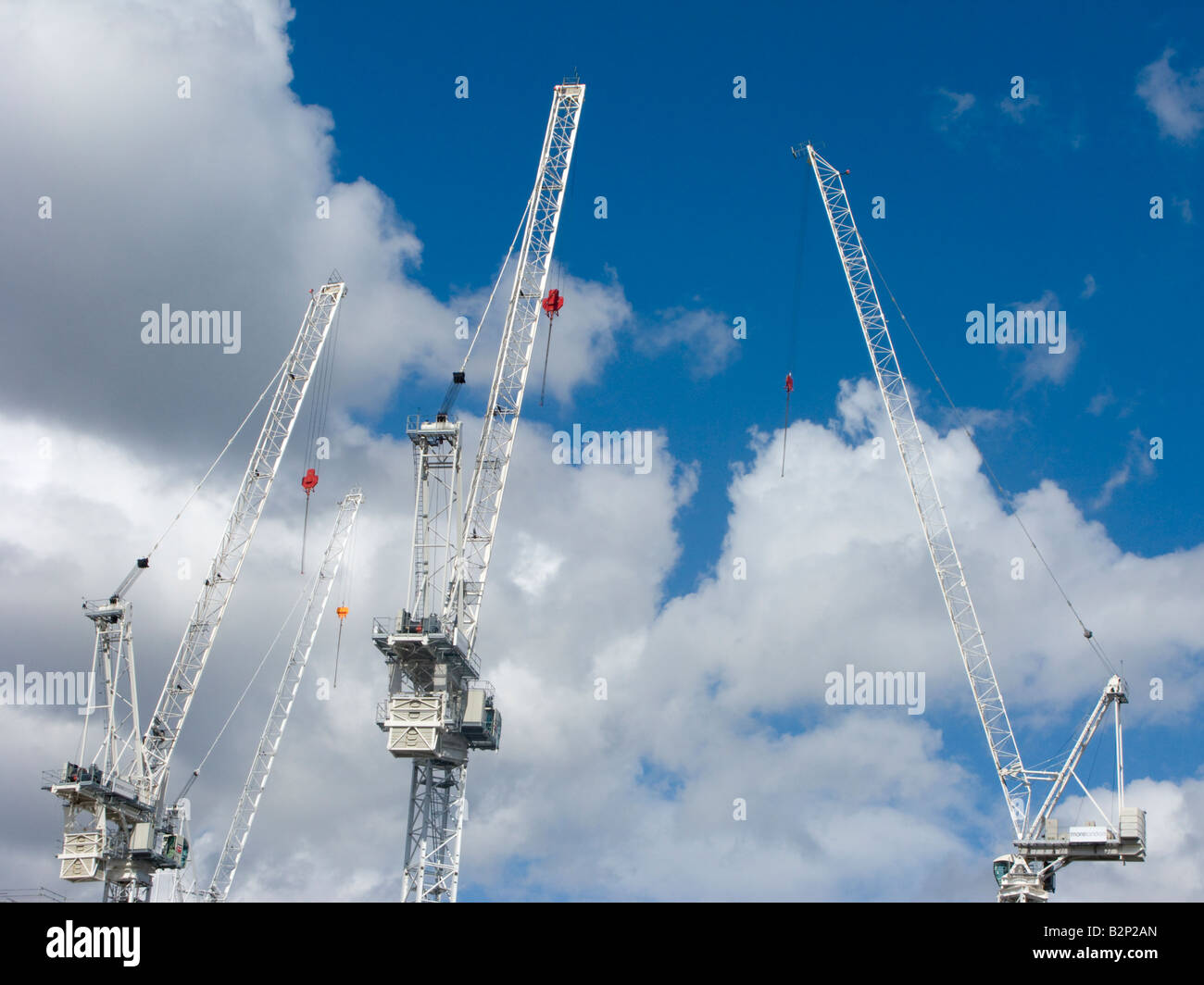 Four construction cranes London UK summer Stock Photo - Alamy
