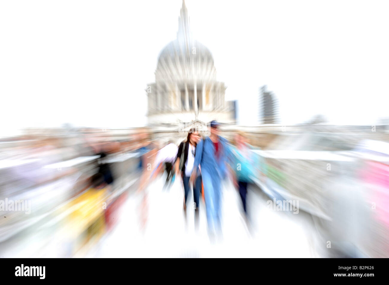 people walking over the Millennium Bridge London with st Paul's ...