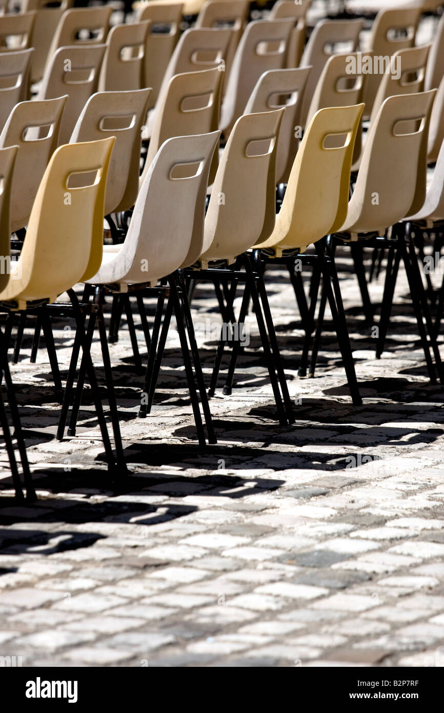 Back view of rows of empty plastic chairs Stock Photo - Alamy