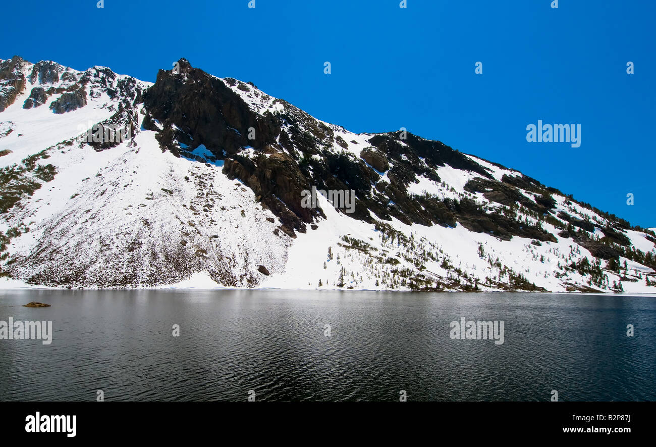 Snowy mountain reflecting in the lake Yosemite National Park California ...