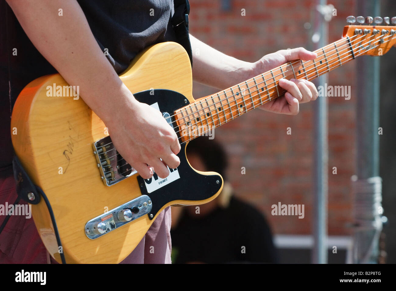 Close up of a male guitarist playing a Fender Telecaster electric ...