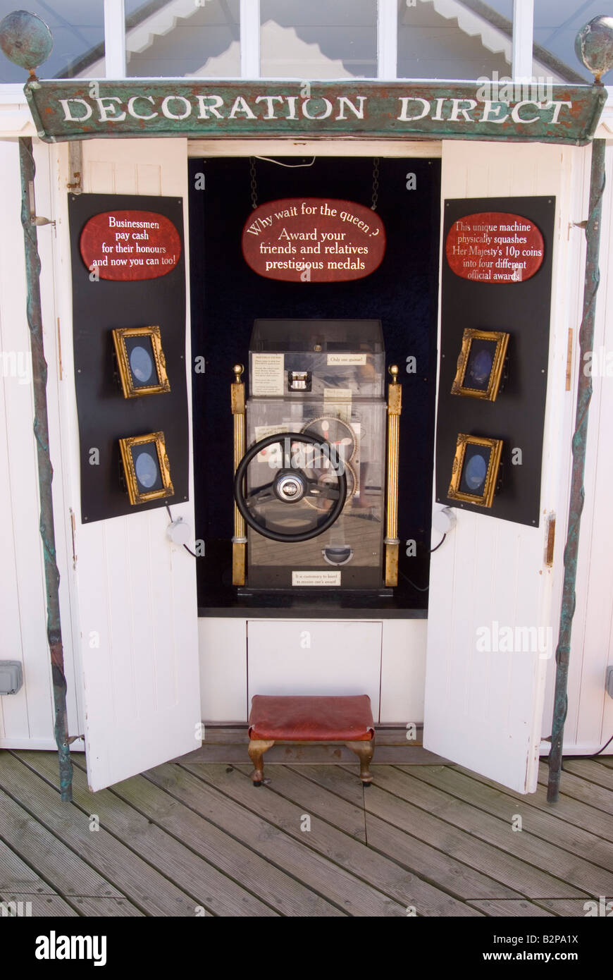 Coin mangling machine on Southwold Pier which presses a stamp onto a ...