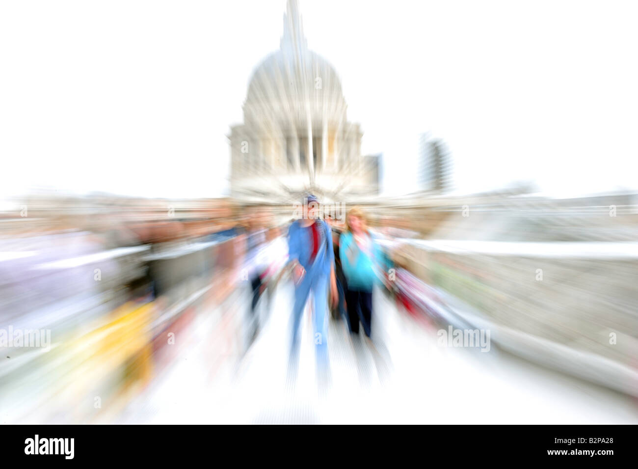 people walking over the Millennium Bridge London with st Paul's ...