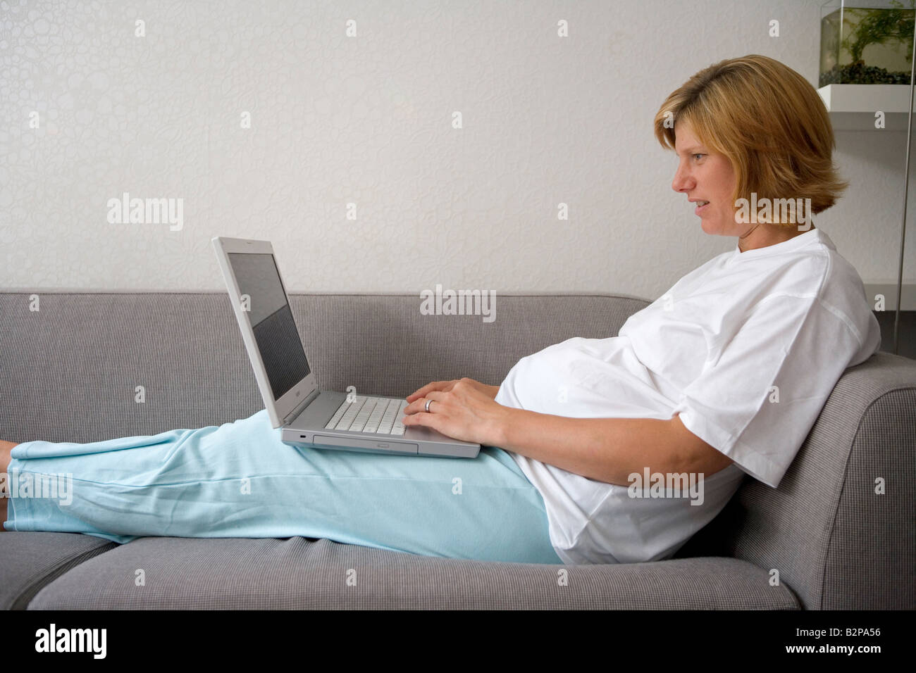 Pregnant woman with a laptop Stock Photo - Alamy