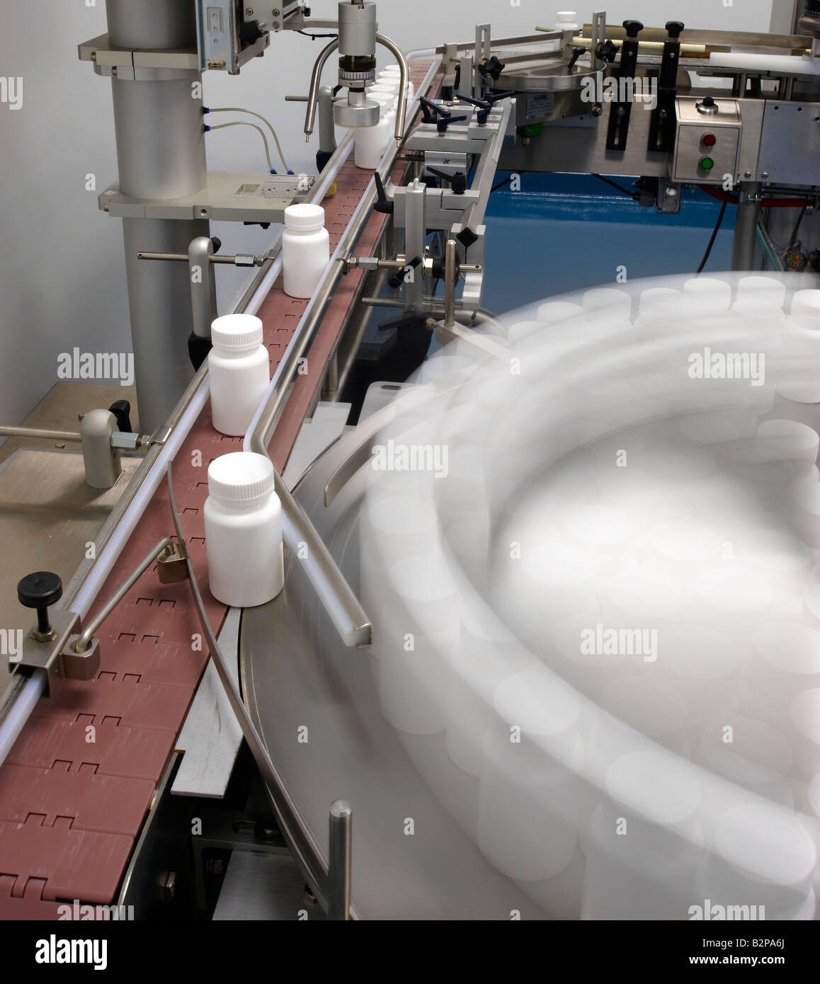 Pill Tablet Medicine Bottles Being Filled In Pharmaceutical Bottling ...