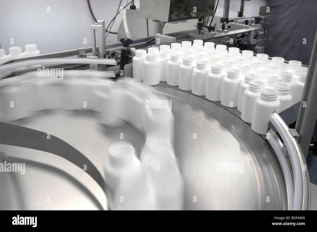 Pill Tablet Medicine Bottles Being Filled In Pharmaceutical Bottling ...