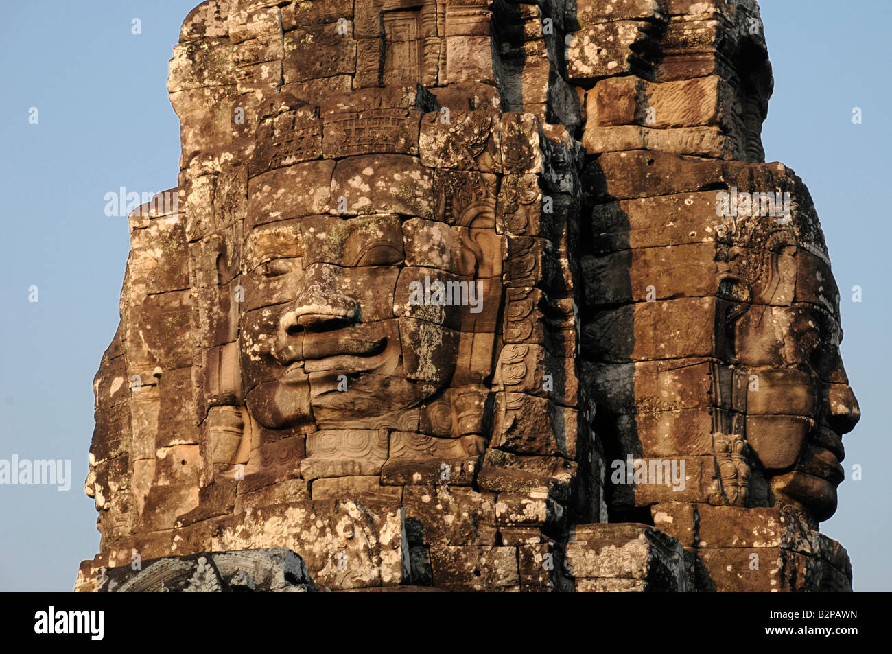 Bayon giant faces in the morning Stock Photo - Alamy