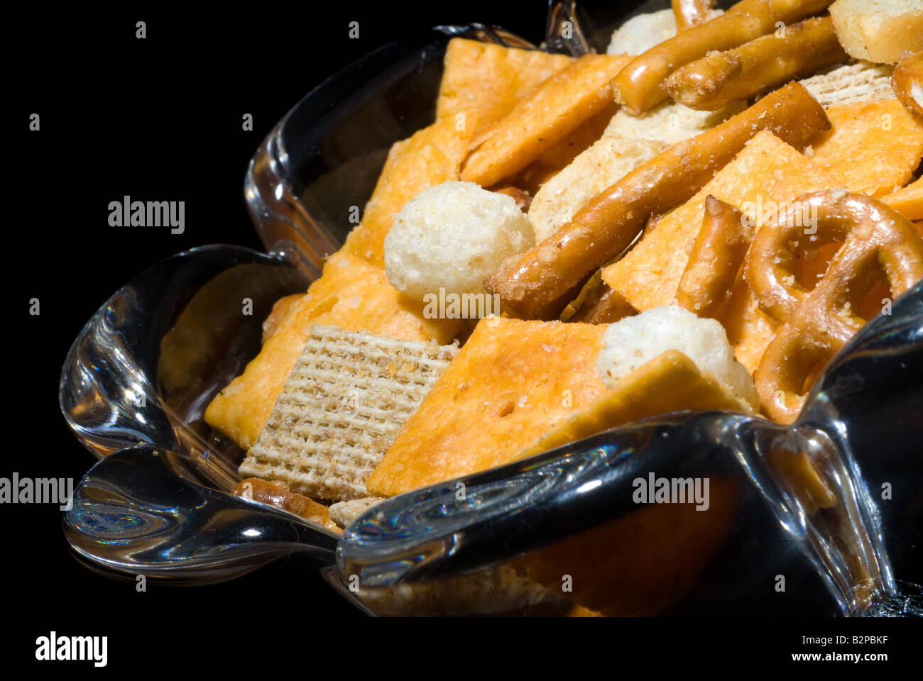 A dish of party snacks isolated against a black background Stock Photo ...