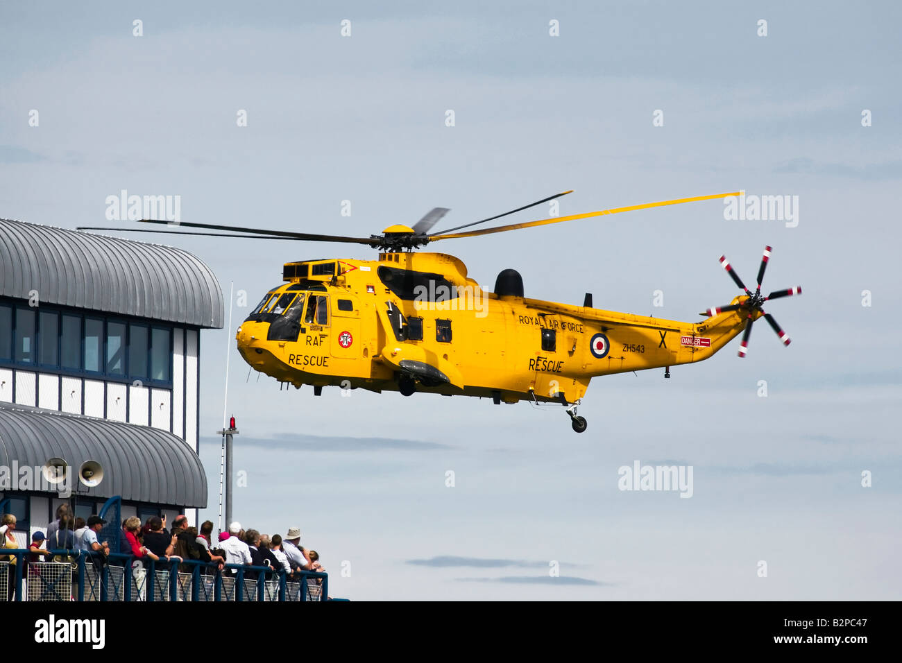 The RAF Sea King rescue helicopter flies low past cromer pier Stock ...