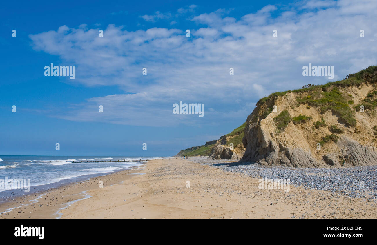 cliffs pebbly beach and sea on a sunny summer's day at Overstrand beach ...