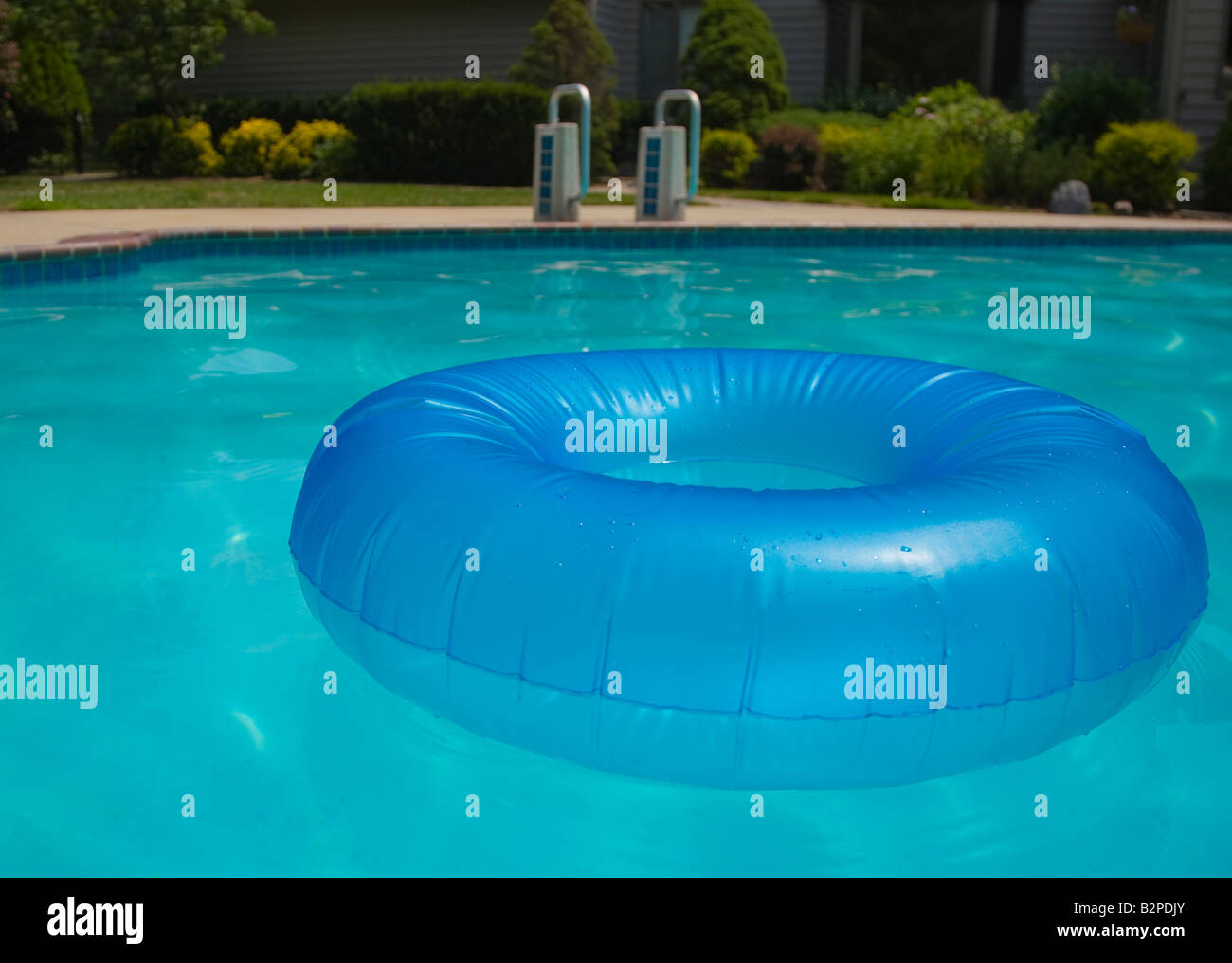 Swimming pool with a floating ring Stock Photo - Alamy