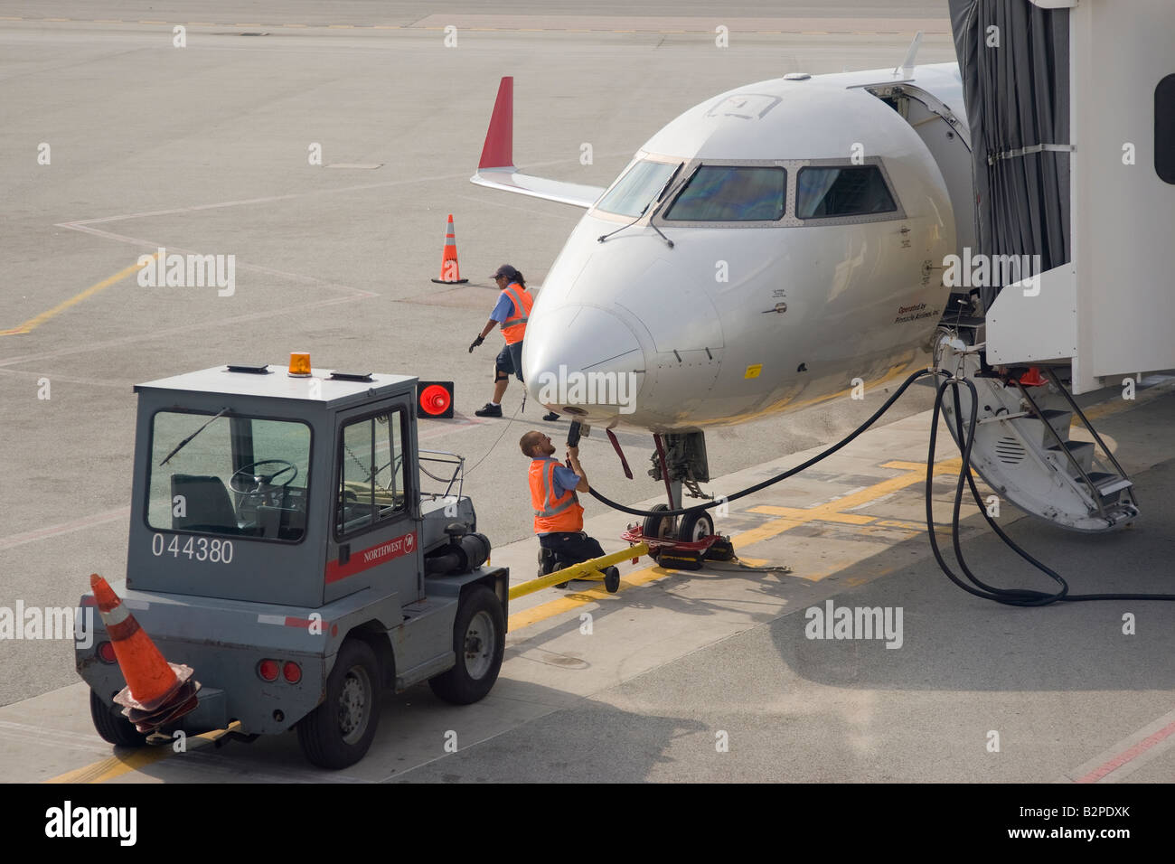 Jet aircraft being serviced Stock Photo - Alamy