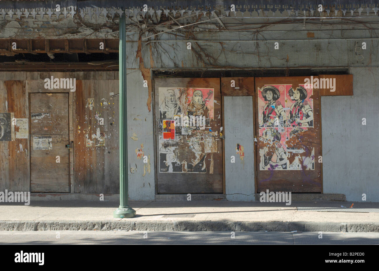 Rundown Building with Posters Stock Photo - Alamy