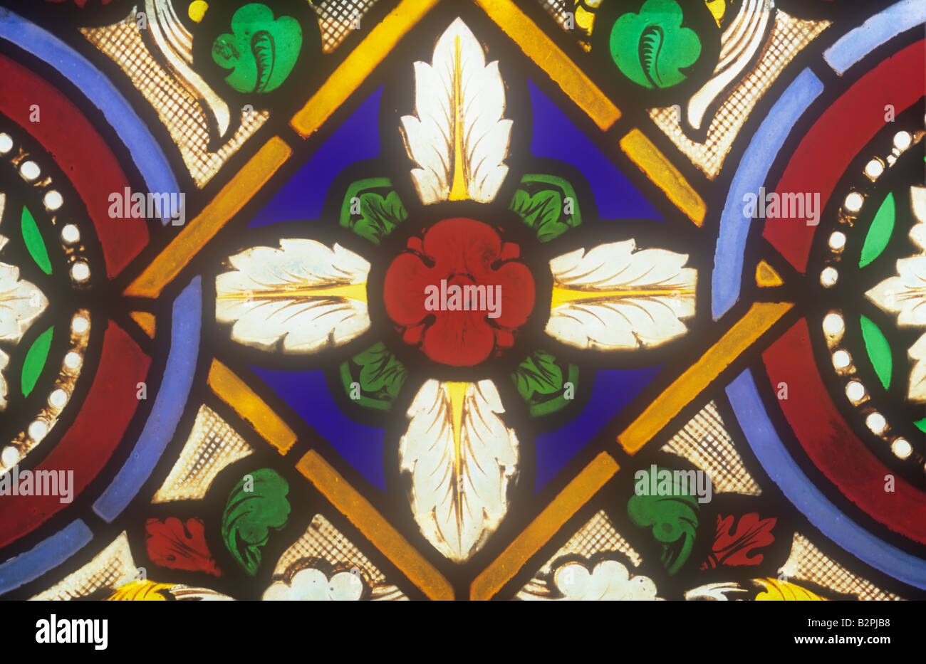 Detail of Victorian stained glass with interwoven diamond and circles ...