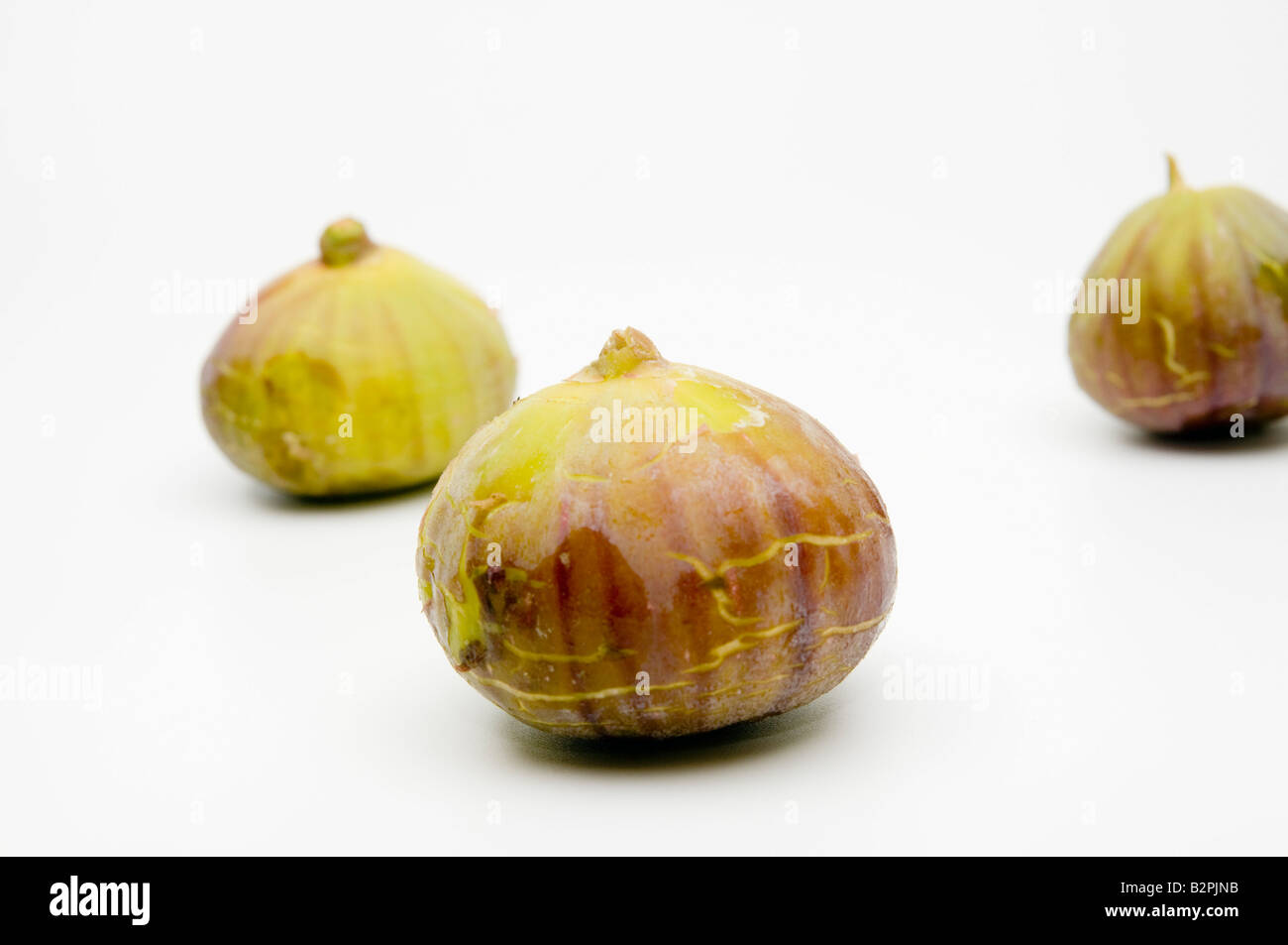 Three Fresh ripe figs on white background Stock Photo - Alamy