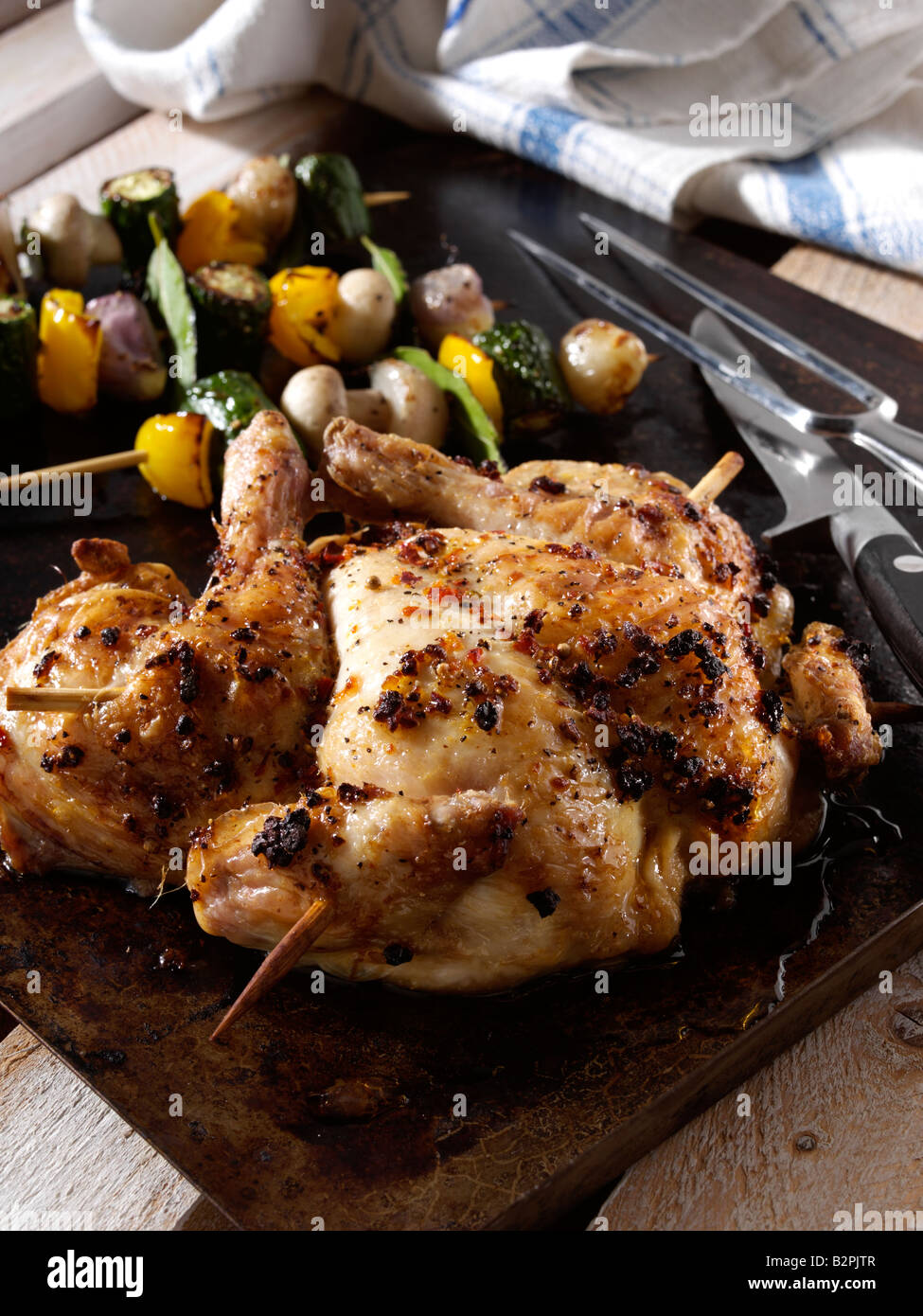 Poussin and vegetable kebabs BBQ editorial food Stock Photo - Alamy