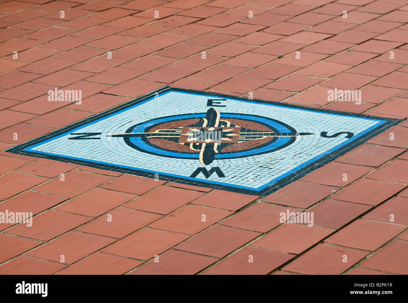 Compass in tiles Stock Photo - Alamy