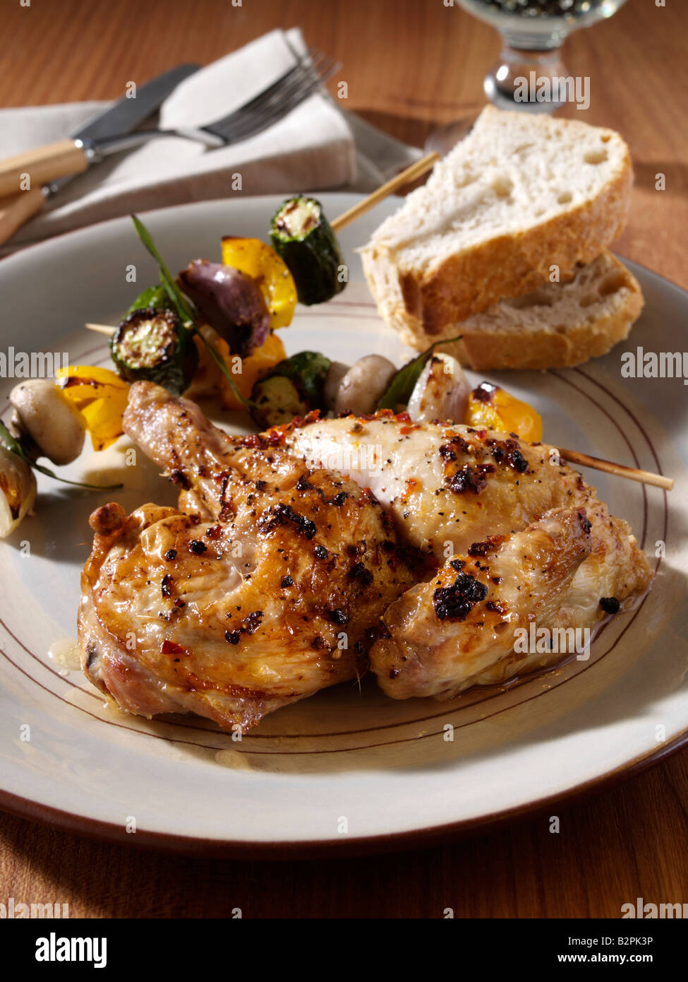 Poussin and vegetable kebabs bbq editorial food Stock Photo - Alamy