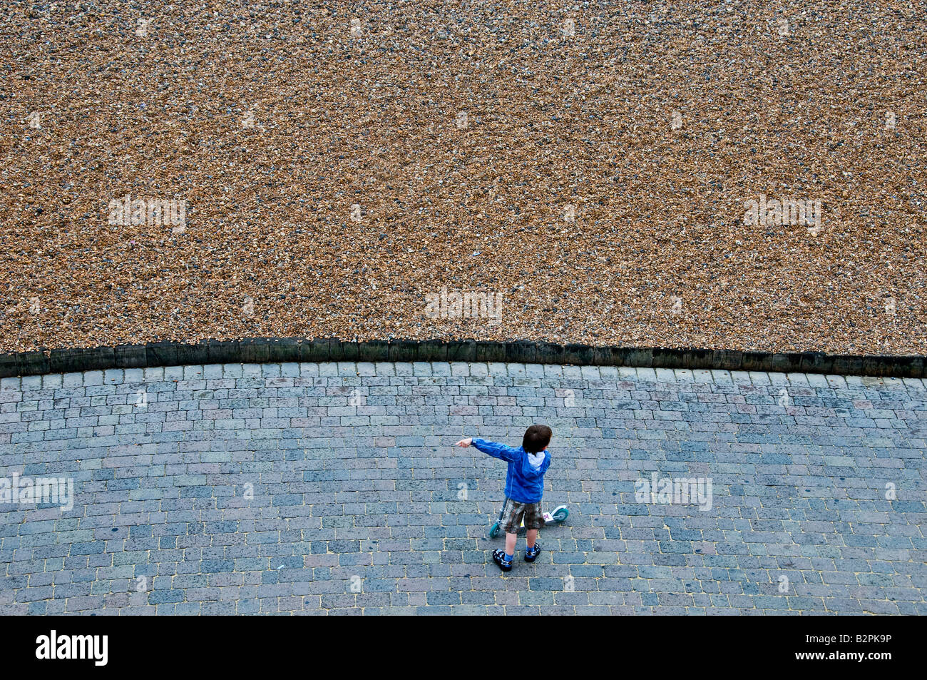 Child on a pavement Stock Photo - Alamy