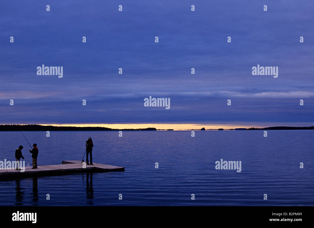 Finland Inarijarvi lake in Inari fisherman in Midnight Sun Stock Photo ...
