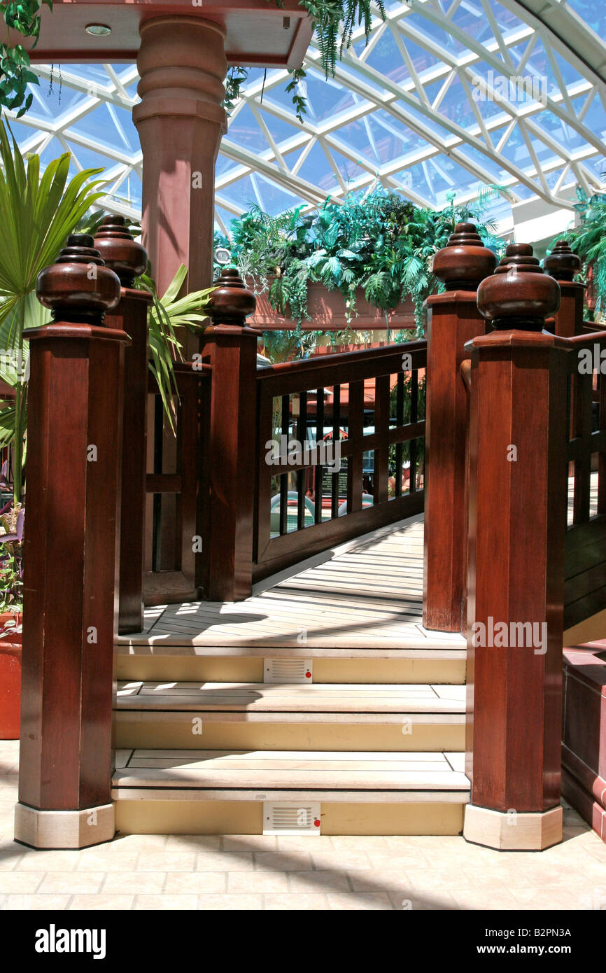 Walkway through a tropical solarium and spa Stock Photo - Alamy