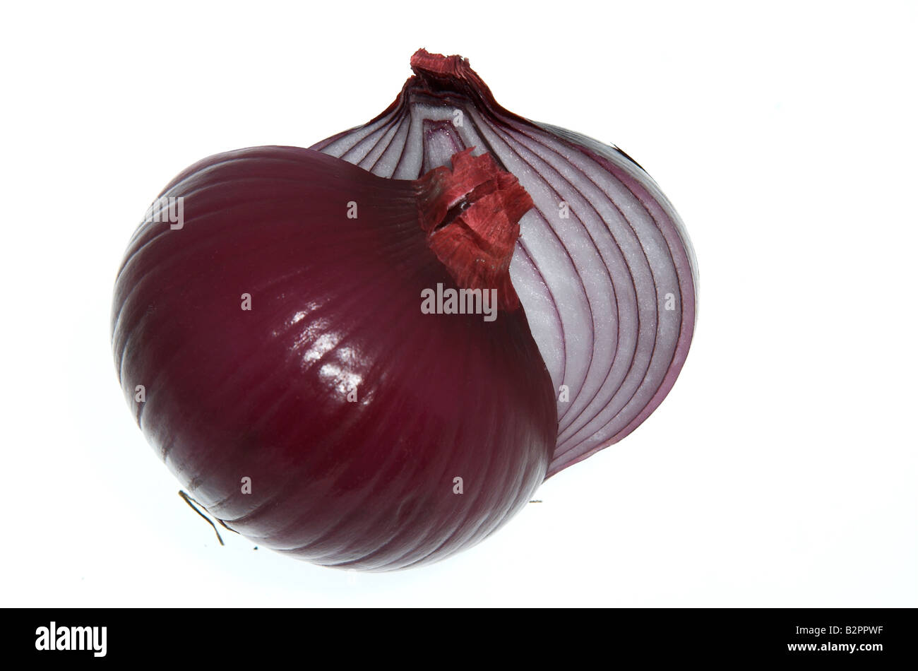 a half open red onion with shiny skin and inside onion layers Stock ...