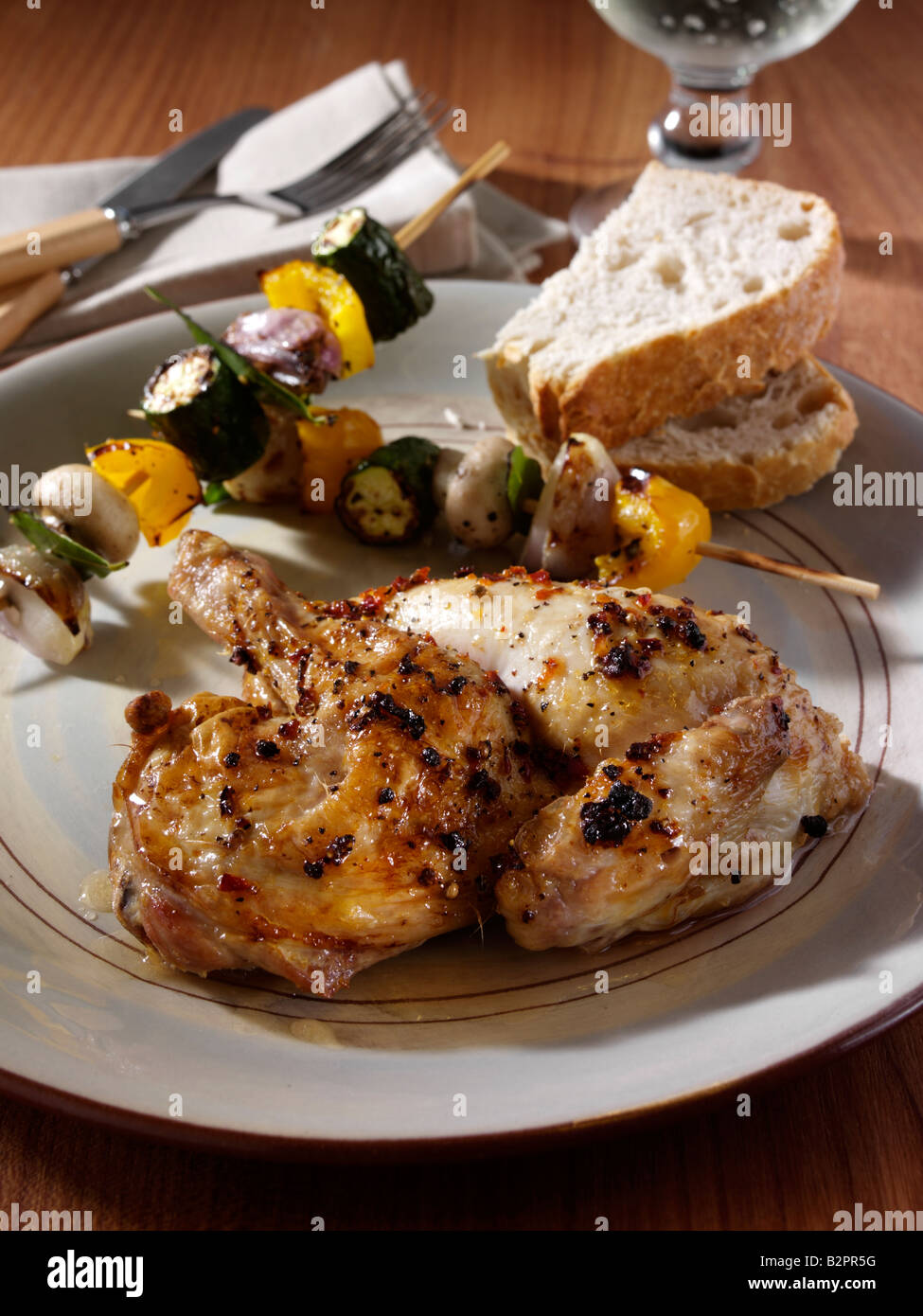 Poussin and vegetable kebabs bbq editorial food Stock Photo - Alamy