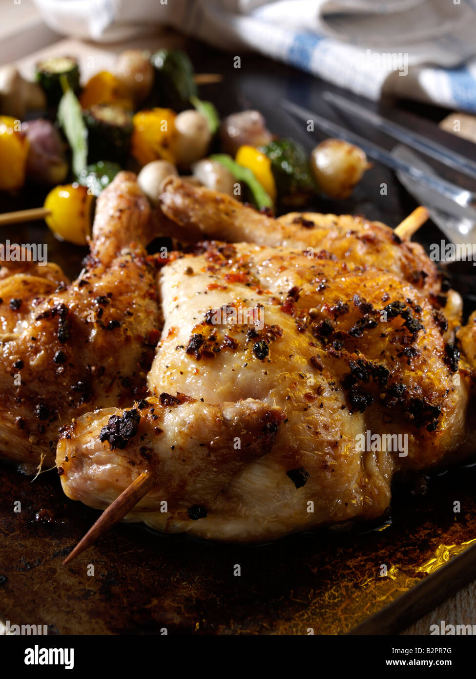 Poussin and vegetable kebabs BBQ editorial food Stock Photo - Alamy
