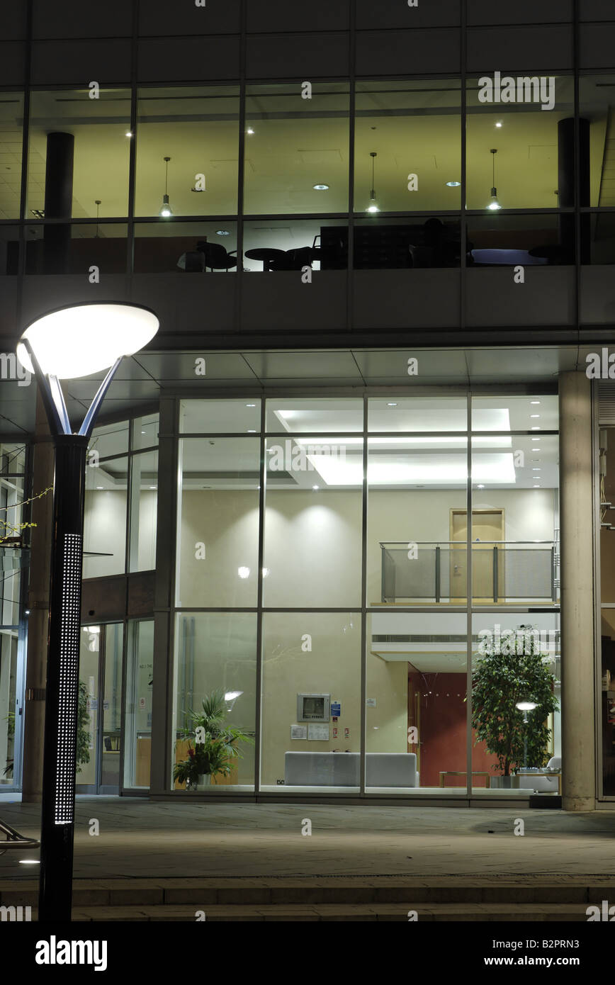 Modern empty office in a city with lights on through the night Stock ...