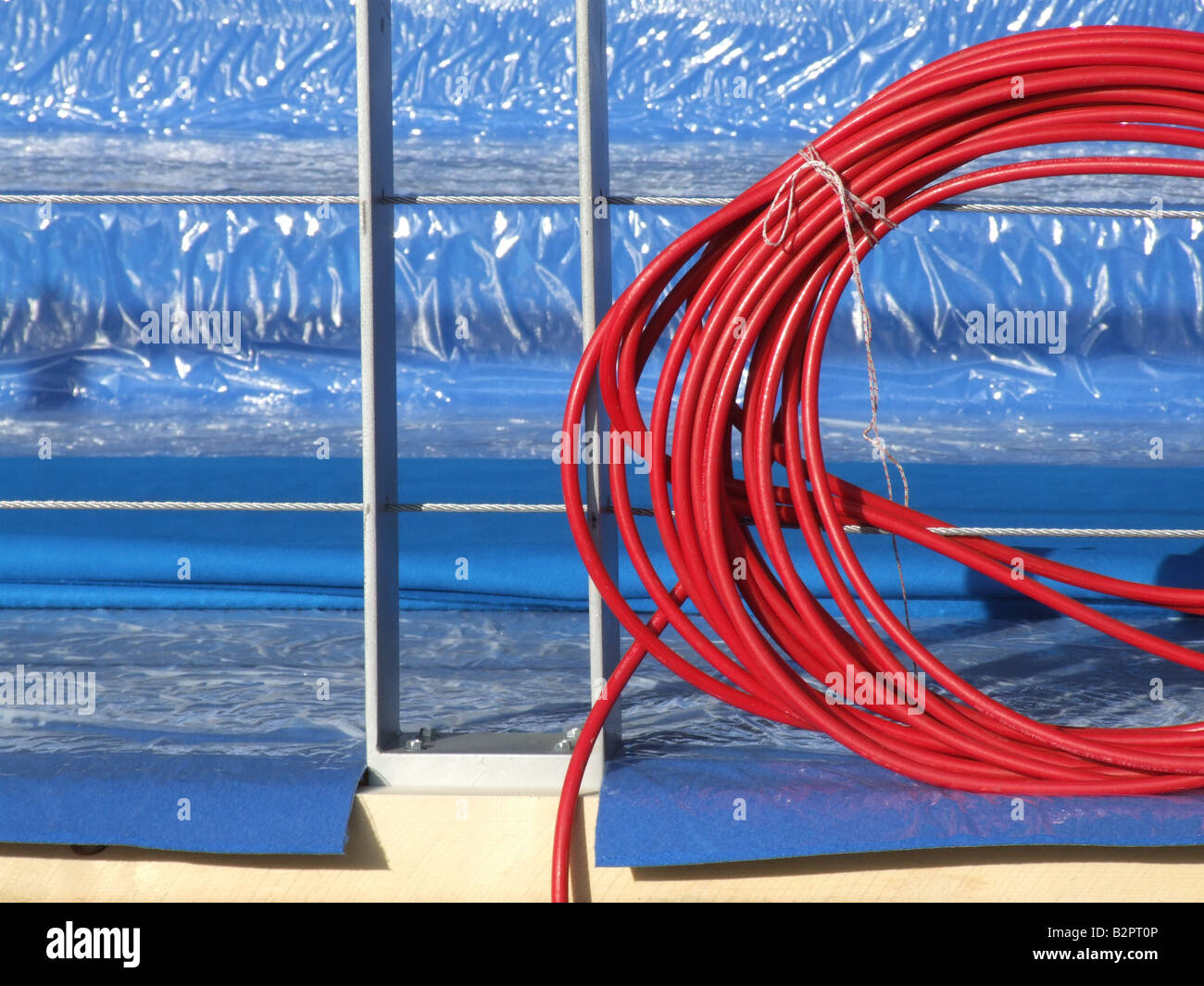 blue steps with plastic cover and red cable coil Stock Photo - Alamy