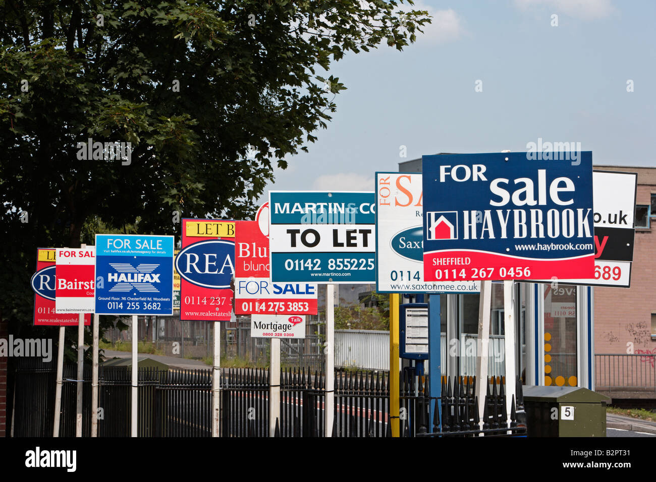 Multiple Estate Agents' Signs Stock Photo - Alamy