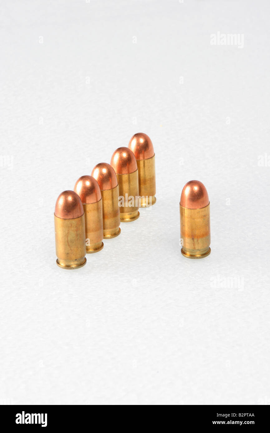 Bullets lined up at attention on a white background Stock Photo - Alamy