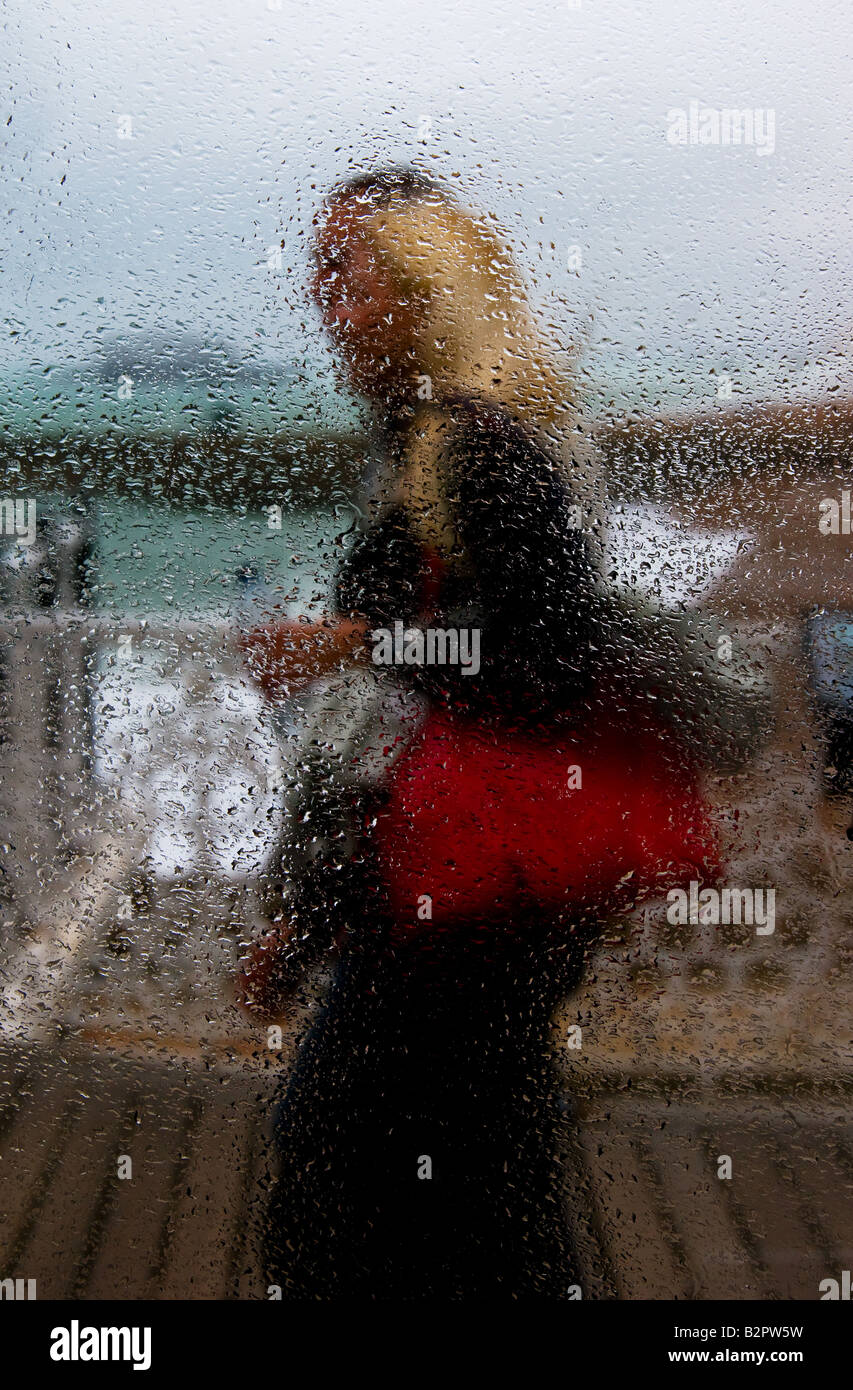 People seen through a window covered in moisture Stock Photo - Alamy