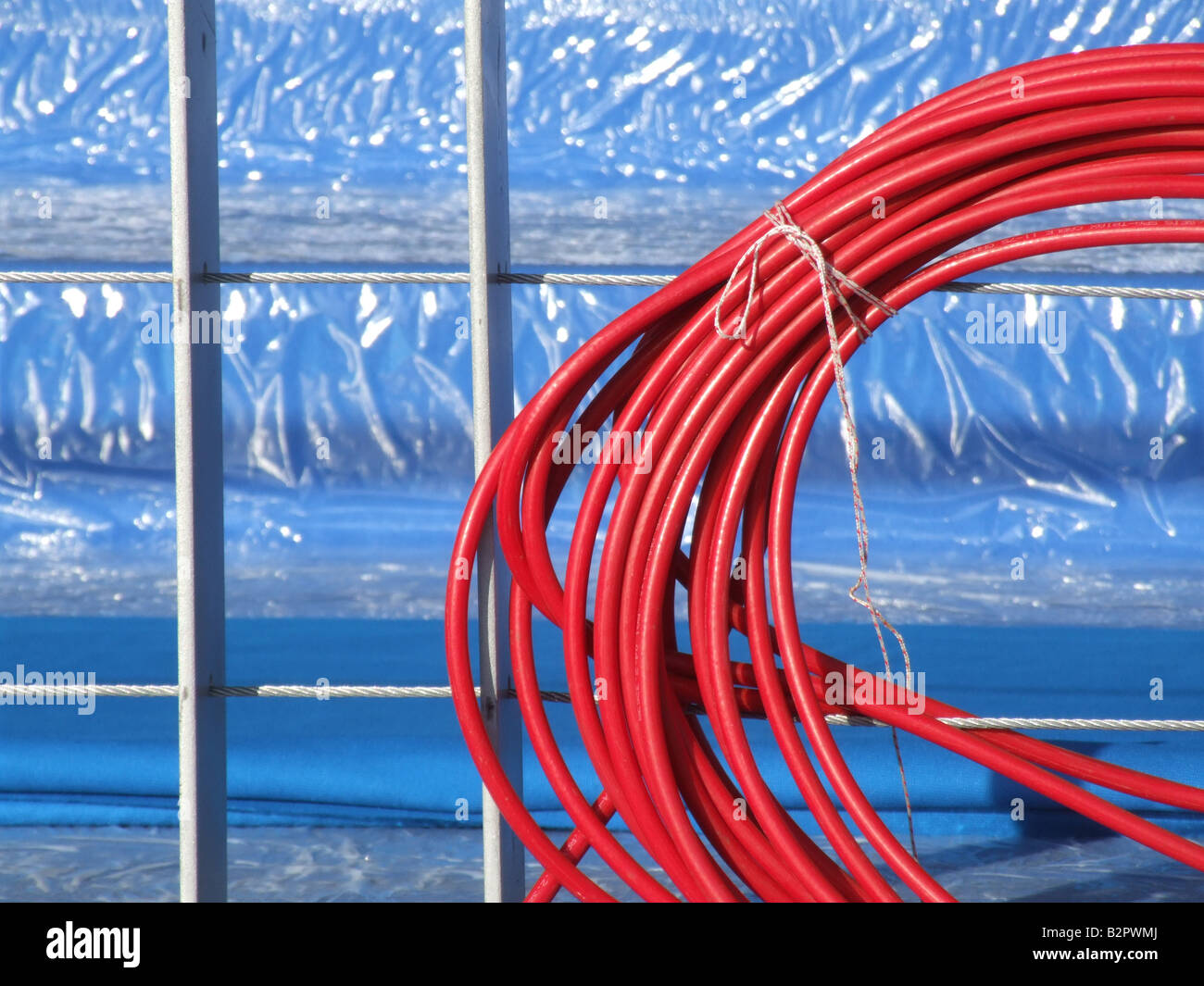 blue steps with plastic cover and red cable coil Stock Photo - Alamy