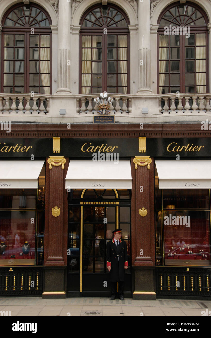Doorman standing outside Cartier jewellers in Old Bond Street London ...