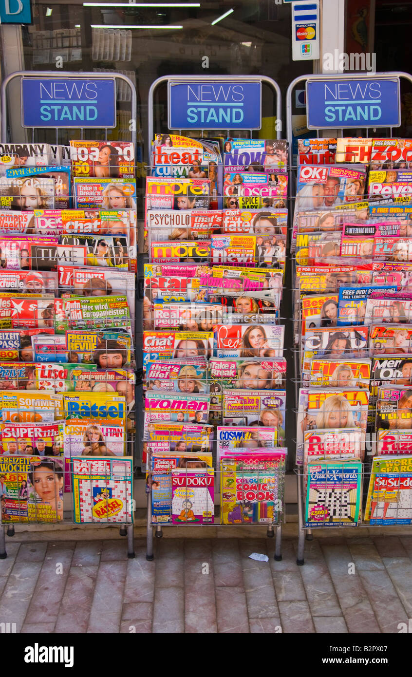 Magazines on newstand outside shop in Malia Old Town on the Greek ...
