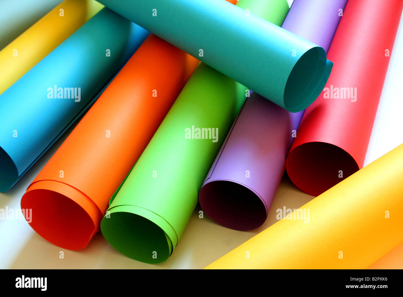 Rolls of colourful paper stacked together Stock Photo - Alamy