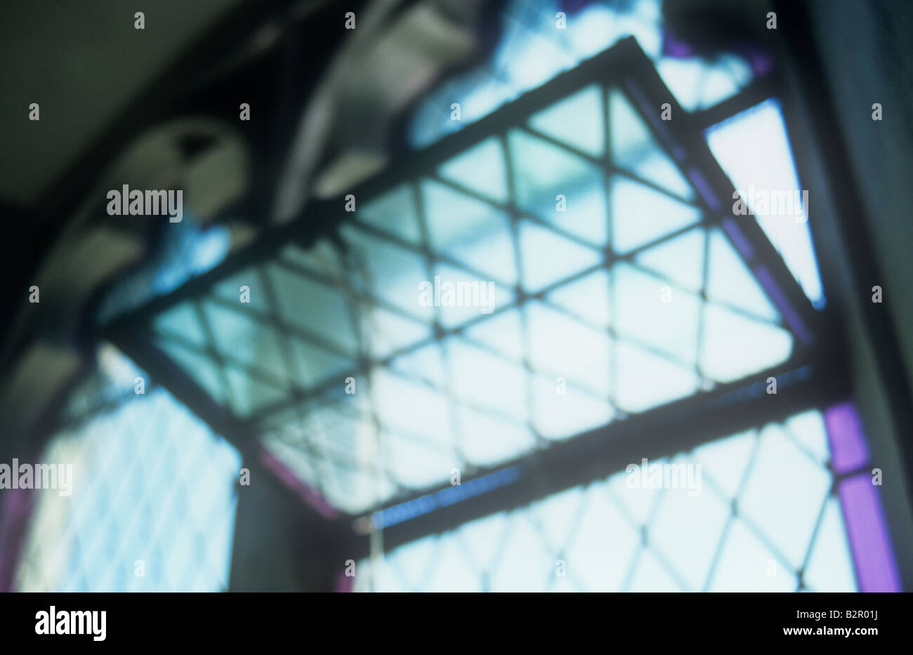 Impressionistic purple-fringed diamond leaded windows in Early English ...