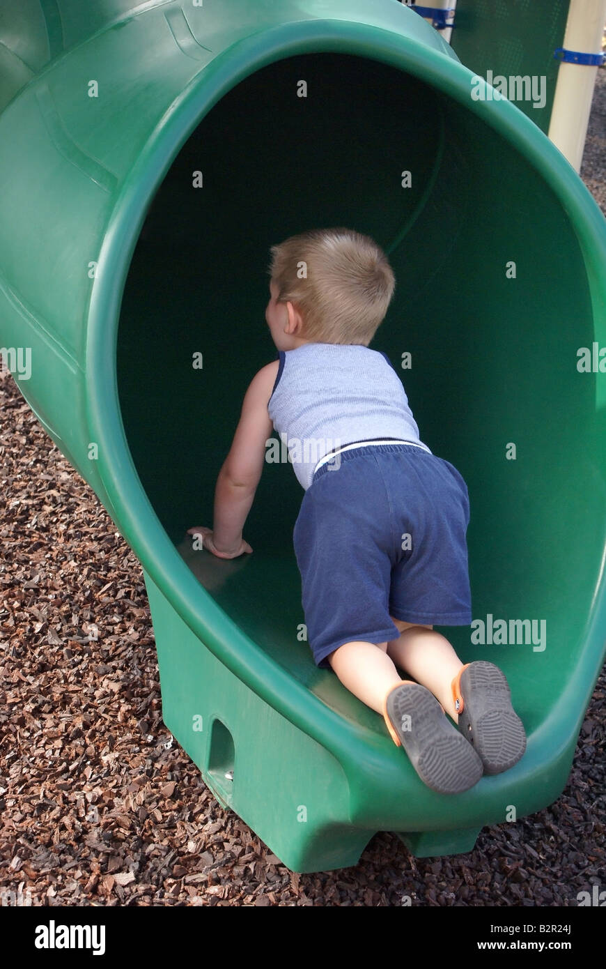 Crawling Up The Down Slide Stock Photo - Alamy