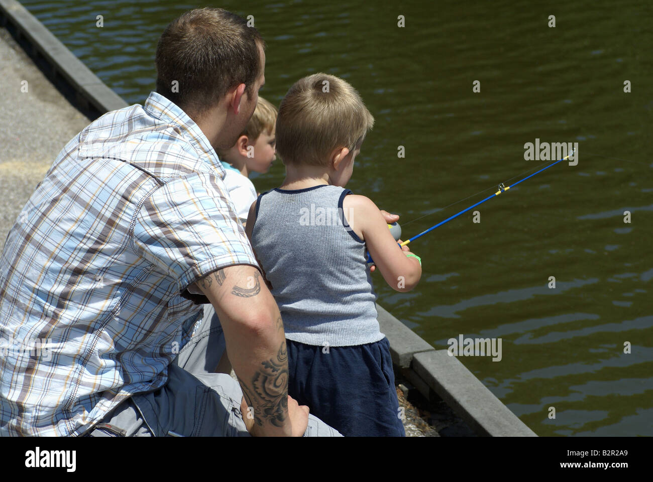 Children Learning To Fish Stock Photo - Alamy